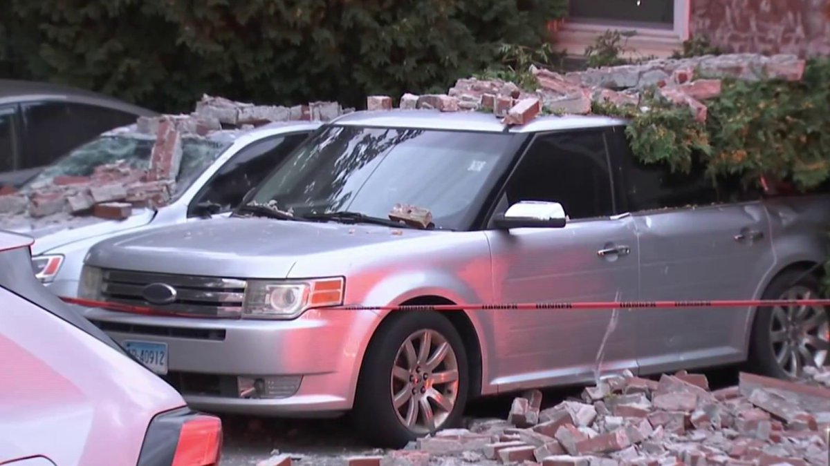 Building collapse damages cars and sends firefighter to the hospital in ...
