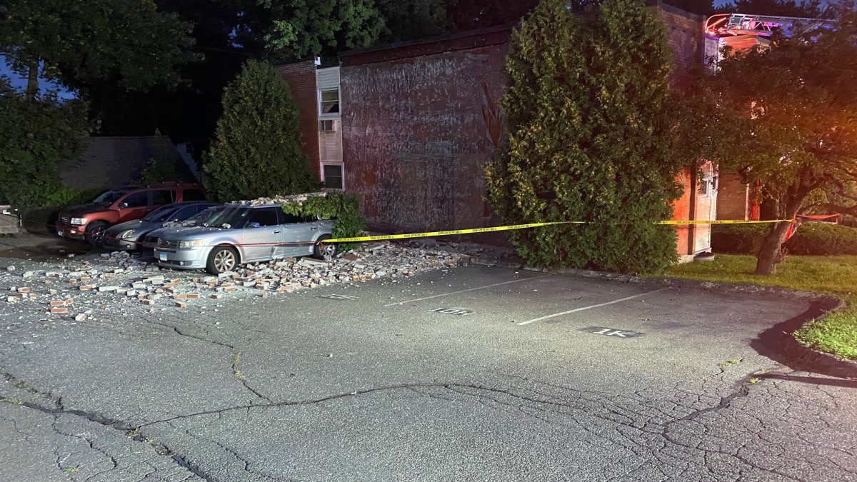 Building collapse damages cars and sends firefighter to the hospital in ...