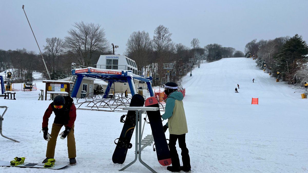 Skiers and snowboarders embrace the snow and bitter cold at Mount ...