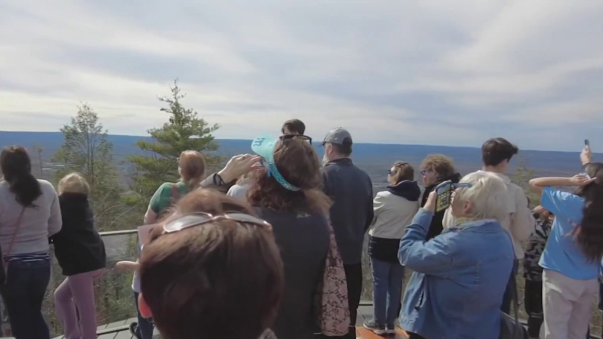 Dozens witness partial solar eclipse at Talcott Mountain Science Center ...