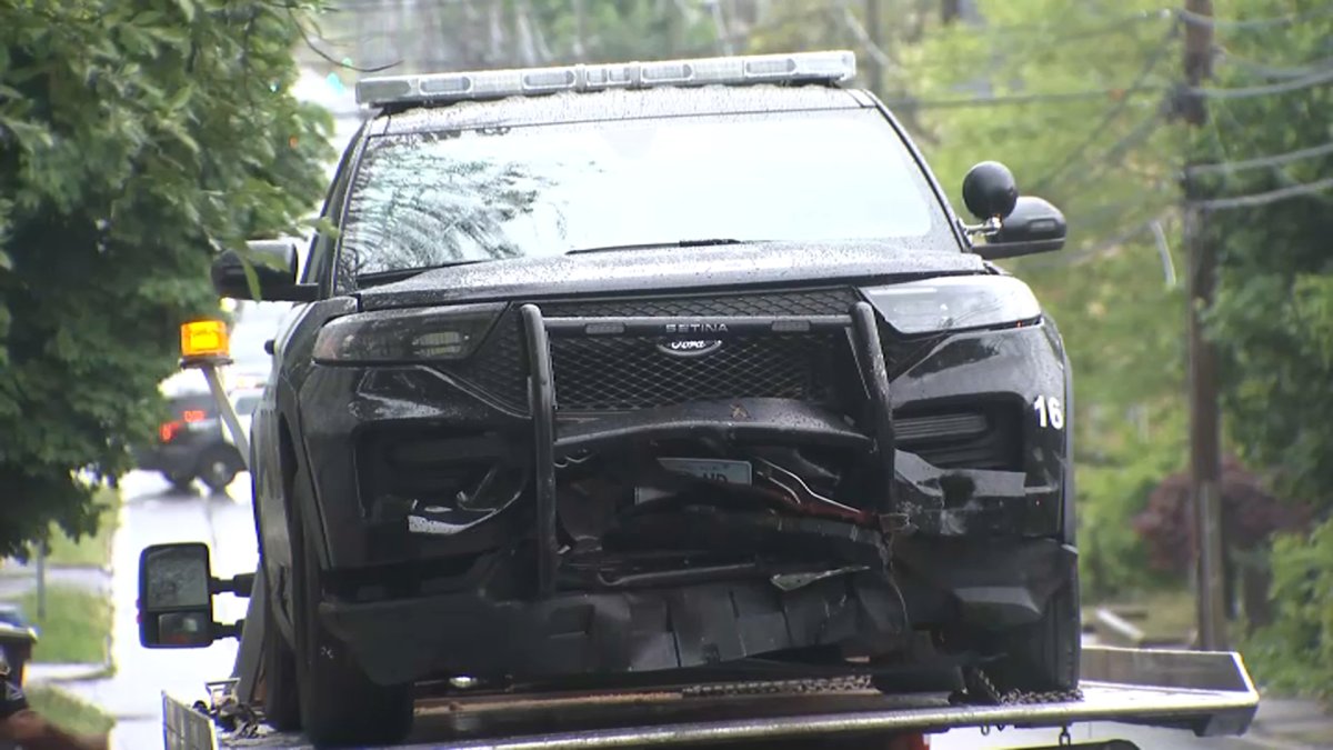 Police officer taken to hospital after car crashes into cruiser in New ...