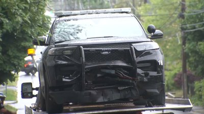 Police officer taken to hospital after car crashes into cruiser in New ...