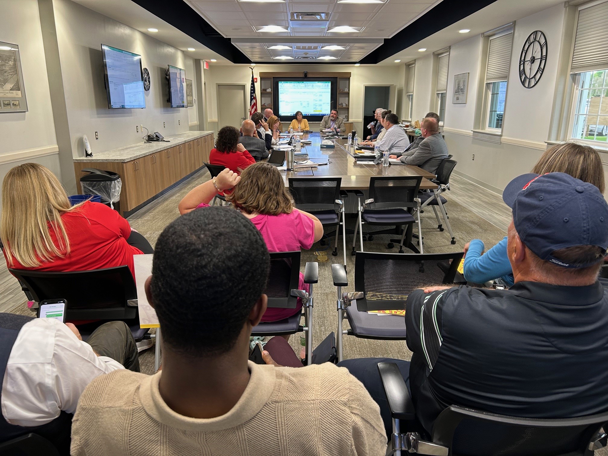 Teachers, community members rally to prevent job & program cuts at ...