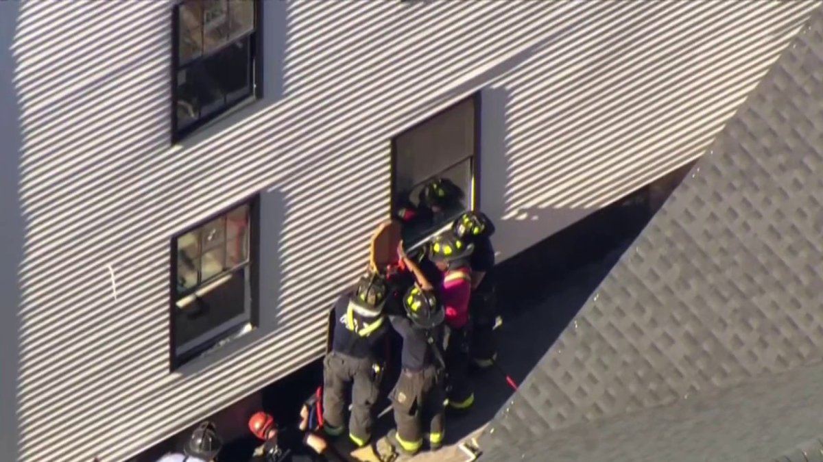 Worker rescued after being trapped under rocks in basement of ...
