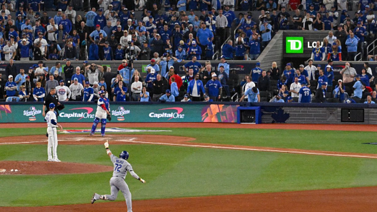 Father and son catch both Dodgers home run balls in Game 7 of World ...